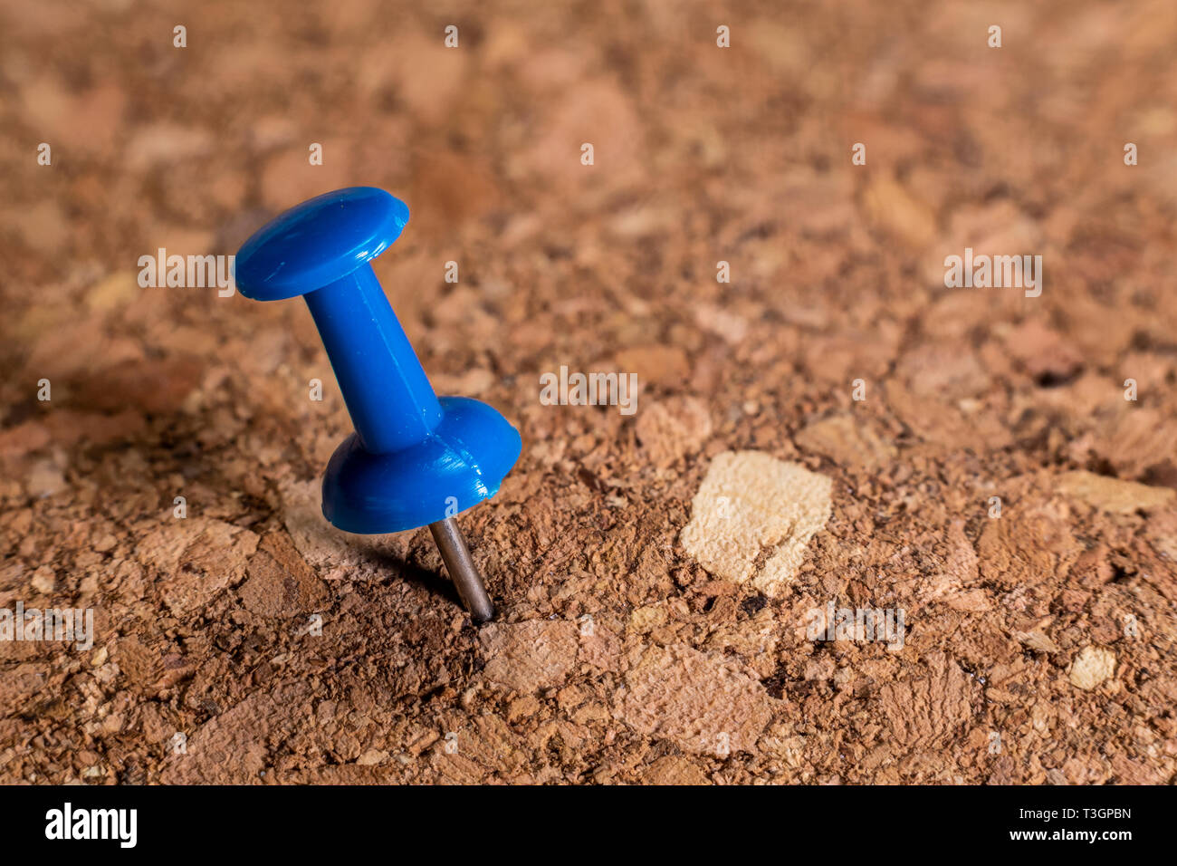 Extreme macro shot of a yellow pin showing the structure of the surface ...