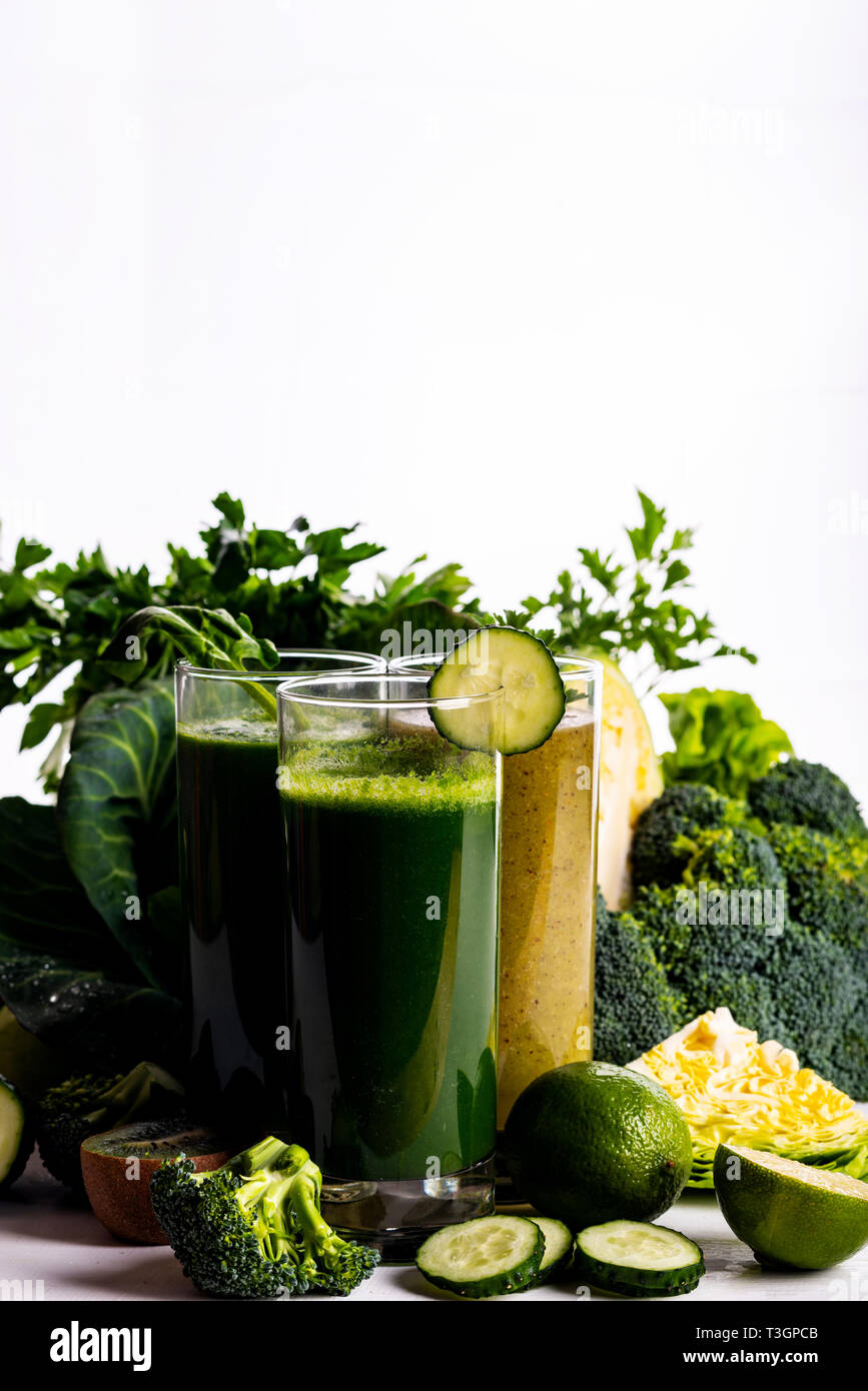 Vegan food and drinks with spinach, kiwi and cucumber on the white ...