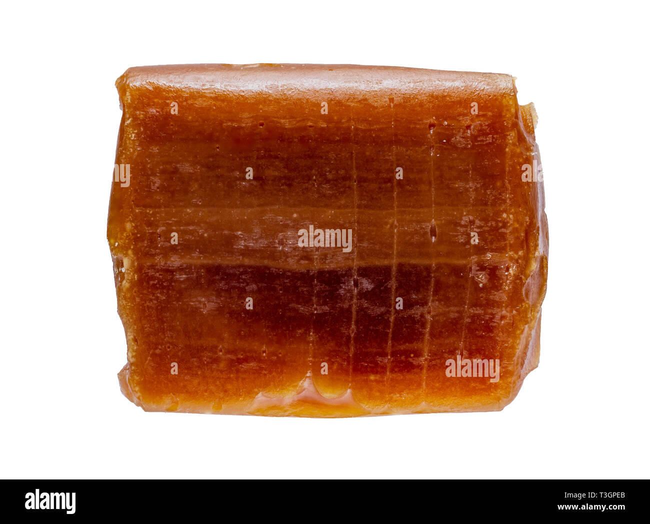 Extreme macro shot of a caramel candy showing the structure of the ...