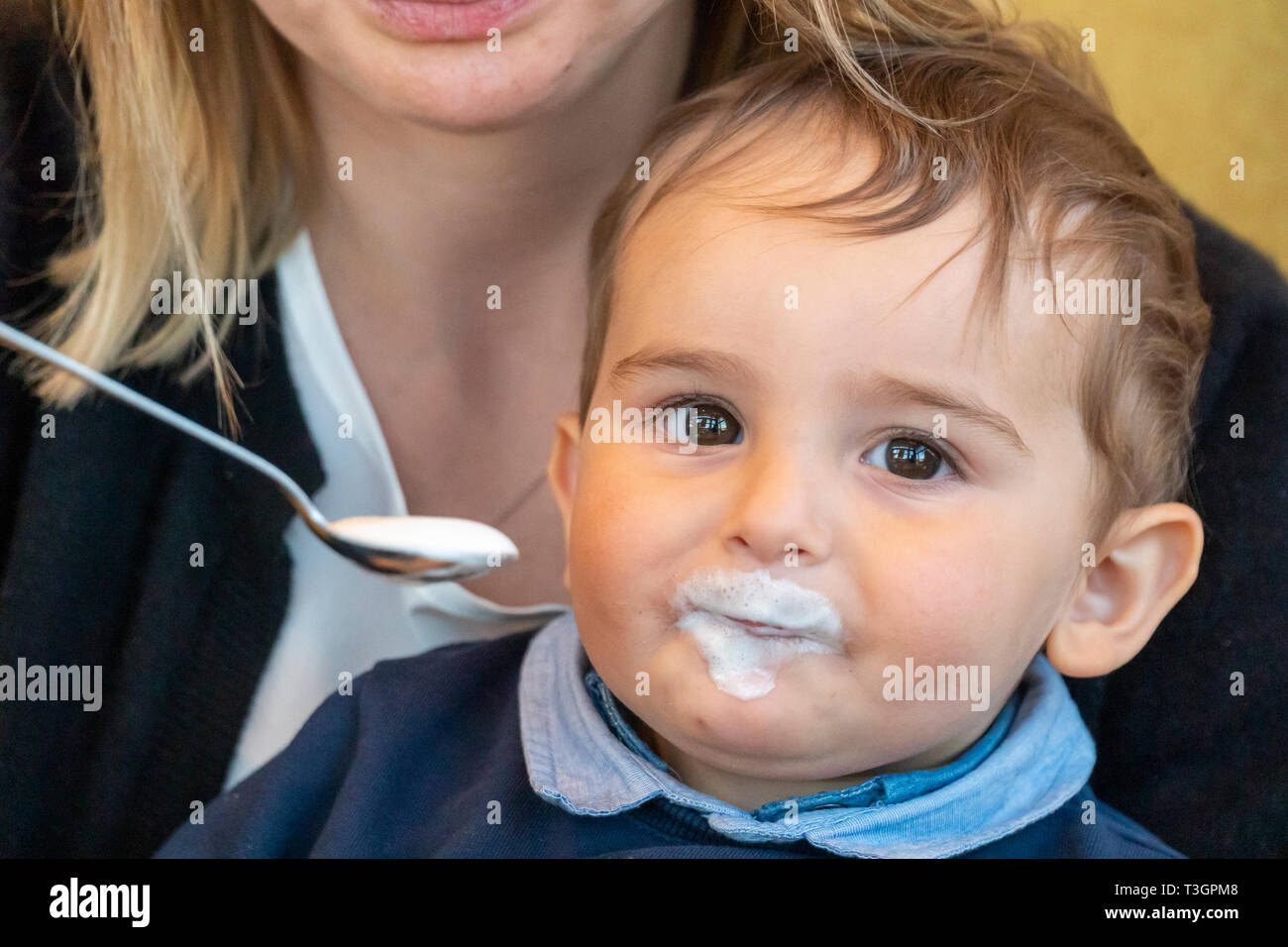 Very cute baby boy with milk mustache smiling at the camera Stock Photo ...