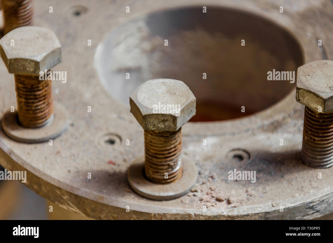 Old rusty bolts in the dust on the pipe joint Stock Photo - Alamy