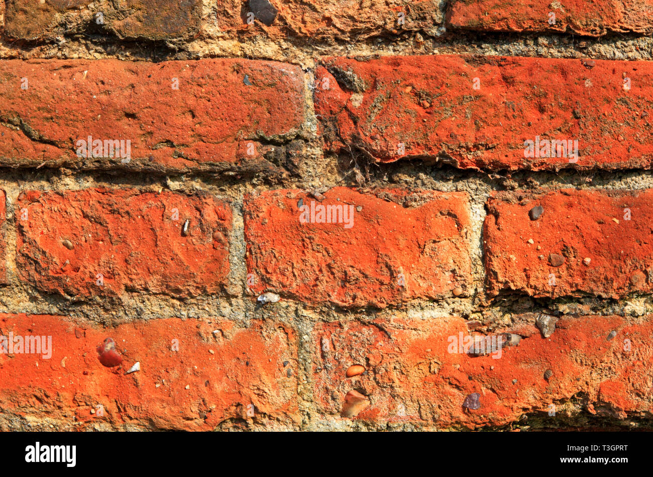 An old weathered red brick wall full of texture and pattern Stock Photo ...