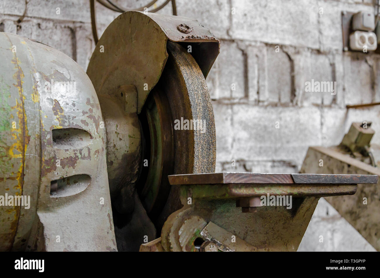 Grinding machine in an old workshop Stock Photo - Alamy