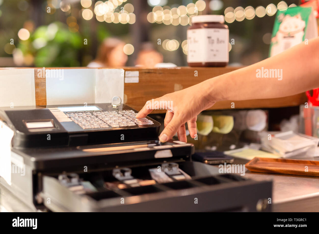 Man cash register hi-res stock photography and images - Alamy