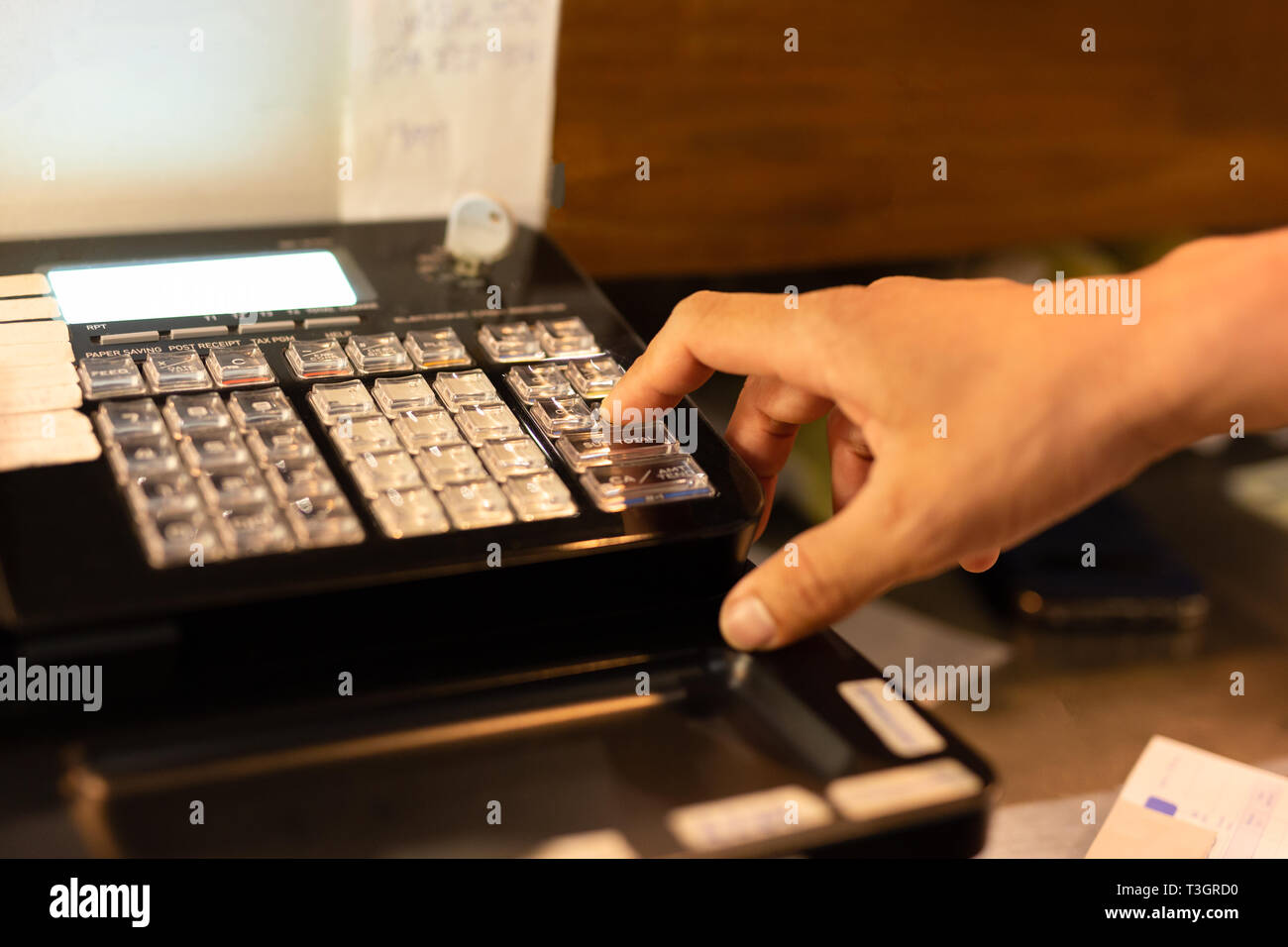 Man cash register hi-res stock photography and images - Alamy