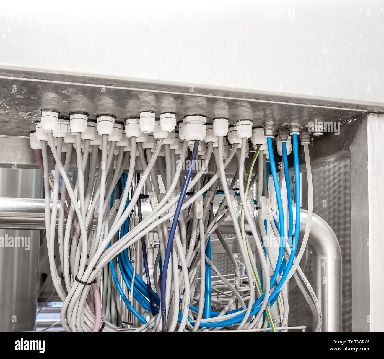 Many wires entering the control box Stock Photo - Alamy