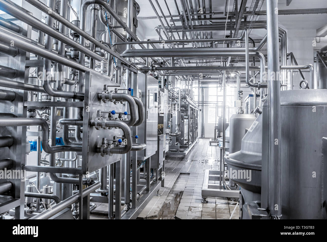 Stainless steel pipes in the factory. Construction on food production ...
