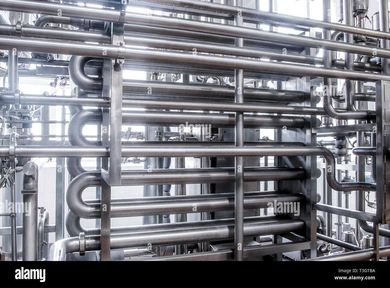 Stainless steel pipes in the factory. Construction on food production ...