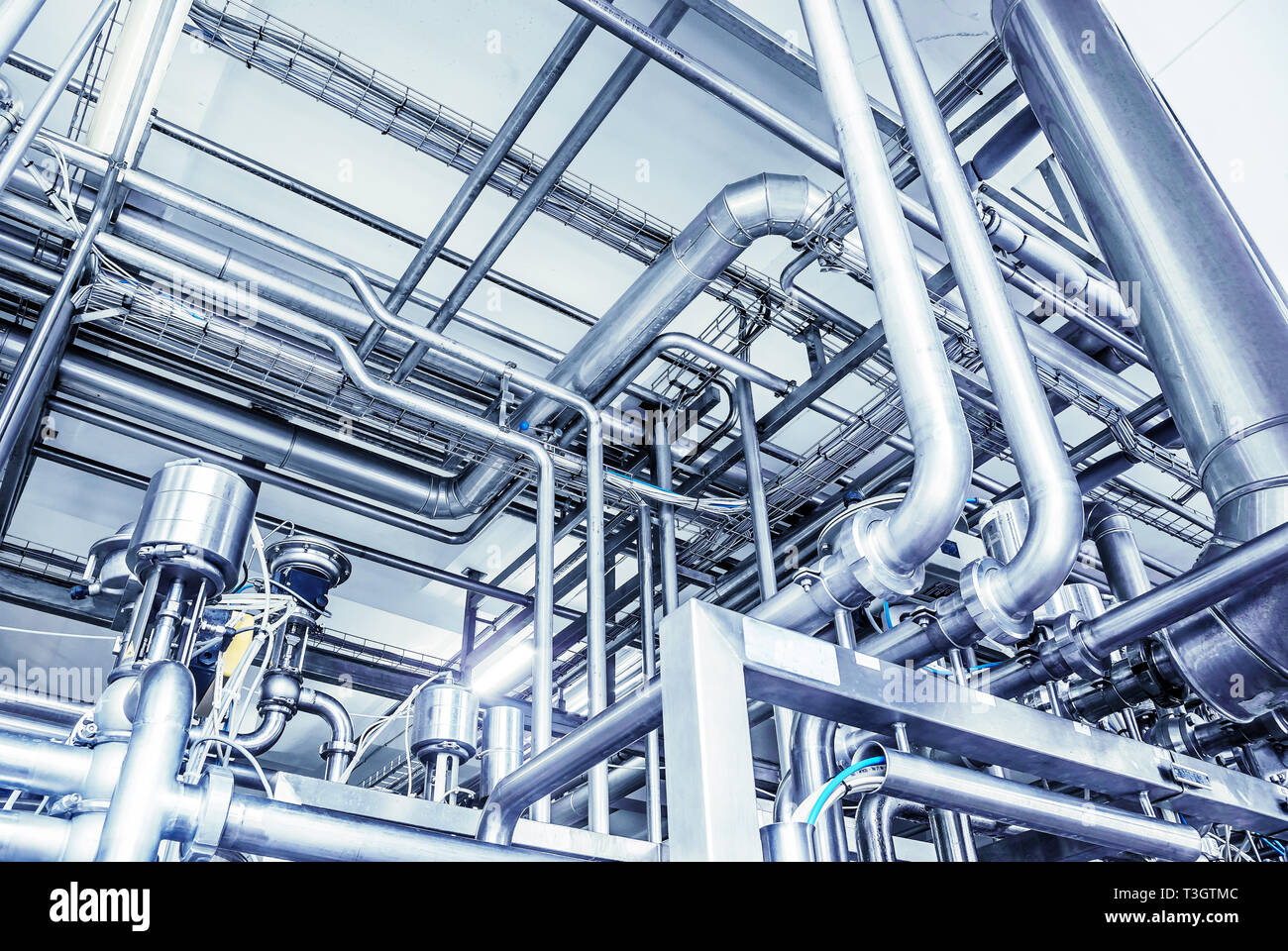Stainless steel pipes in the factory. Construction on food production ...