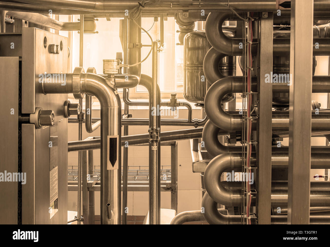 Stainless steel pipes in the factory. Construction on food production ...