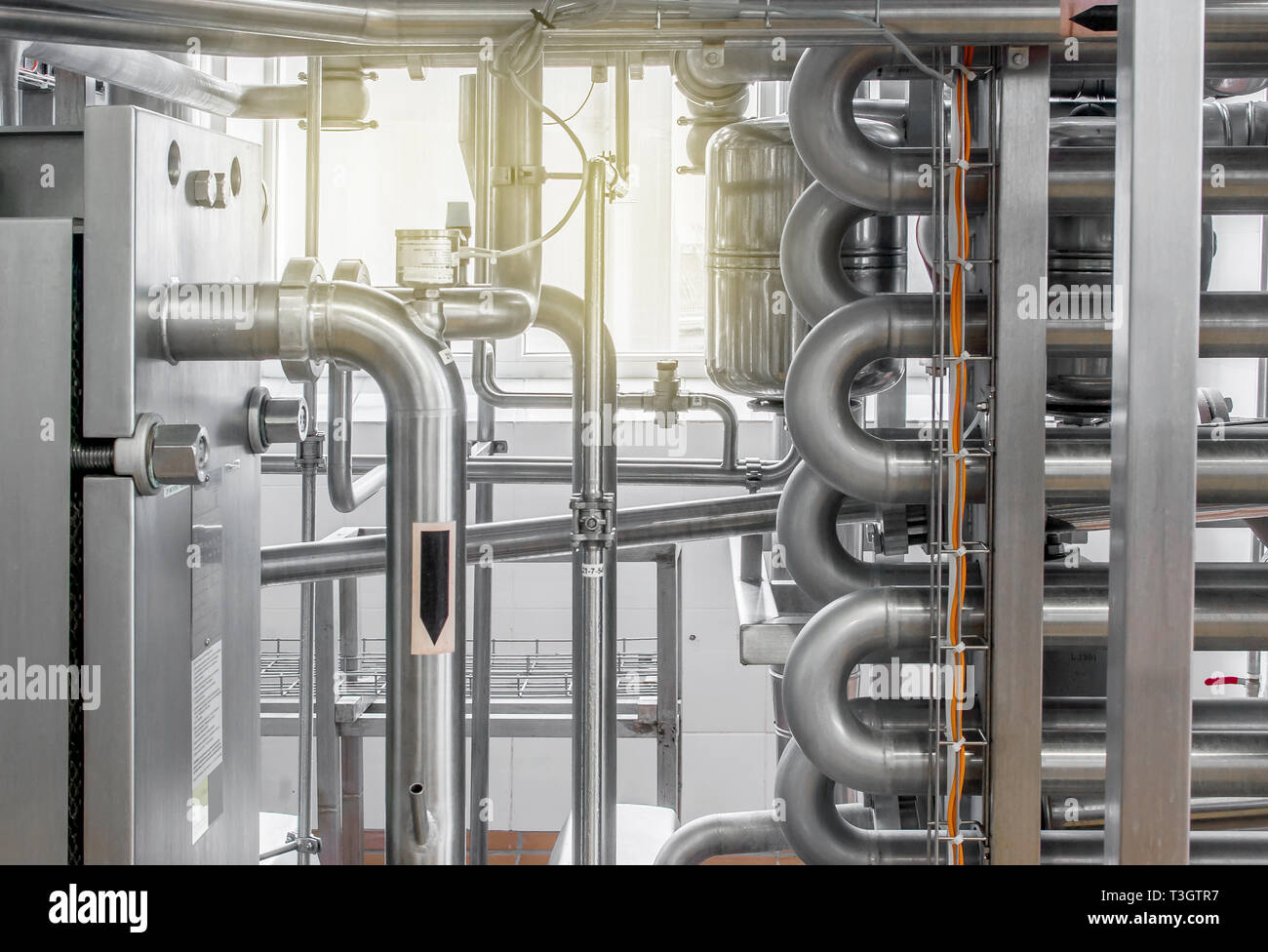 Stainless steel pipes in the factory. Construction on food production ...