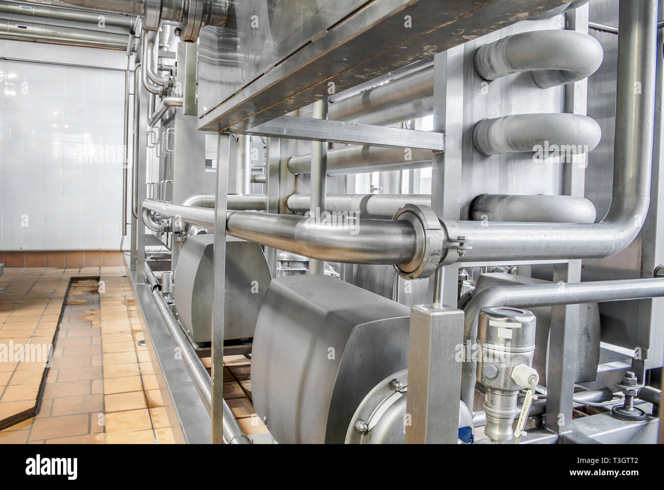 Stainless steel pipes in the factory. Construction on food production ...