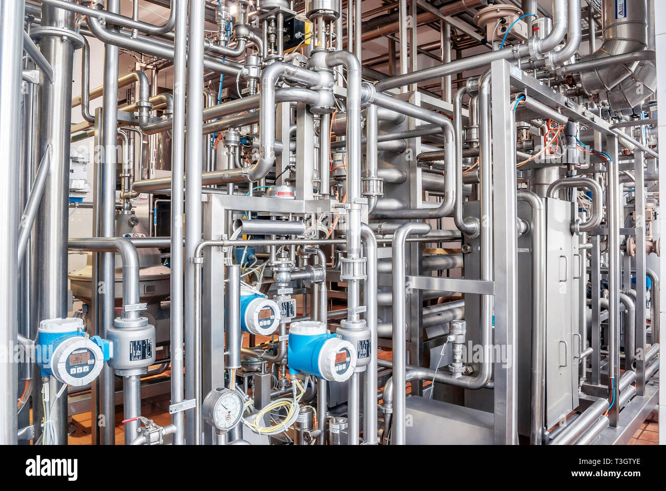 Stainless steel pipes in the factory. Construction on food production ...