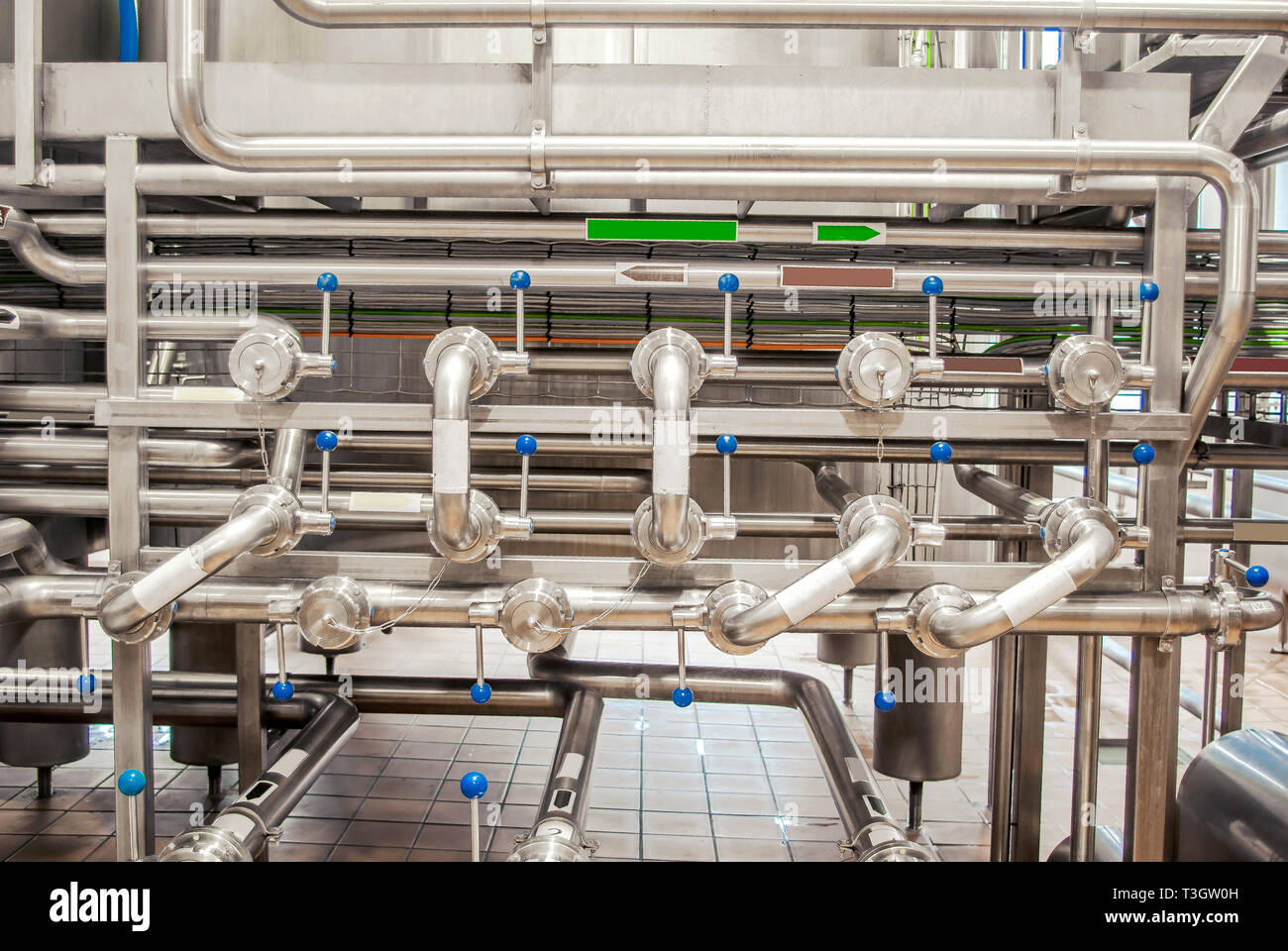 Stainless steel pipes in the factory. Construction on food production ...