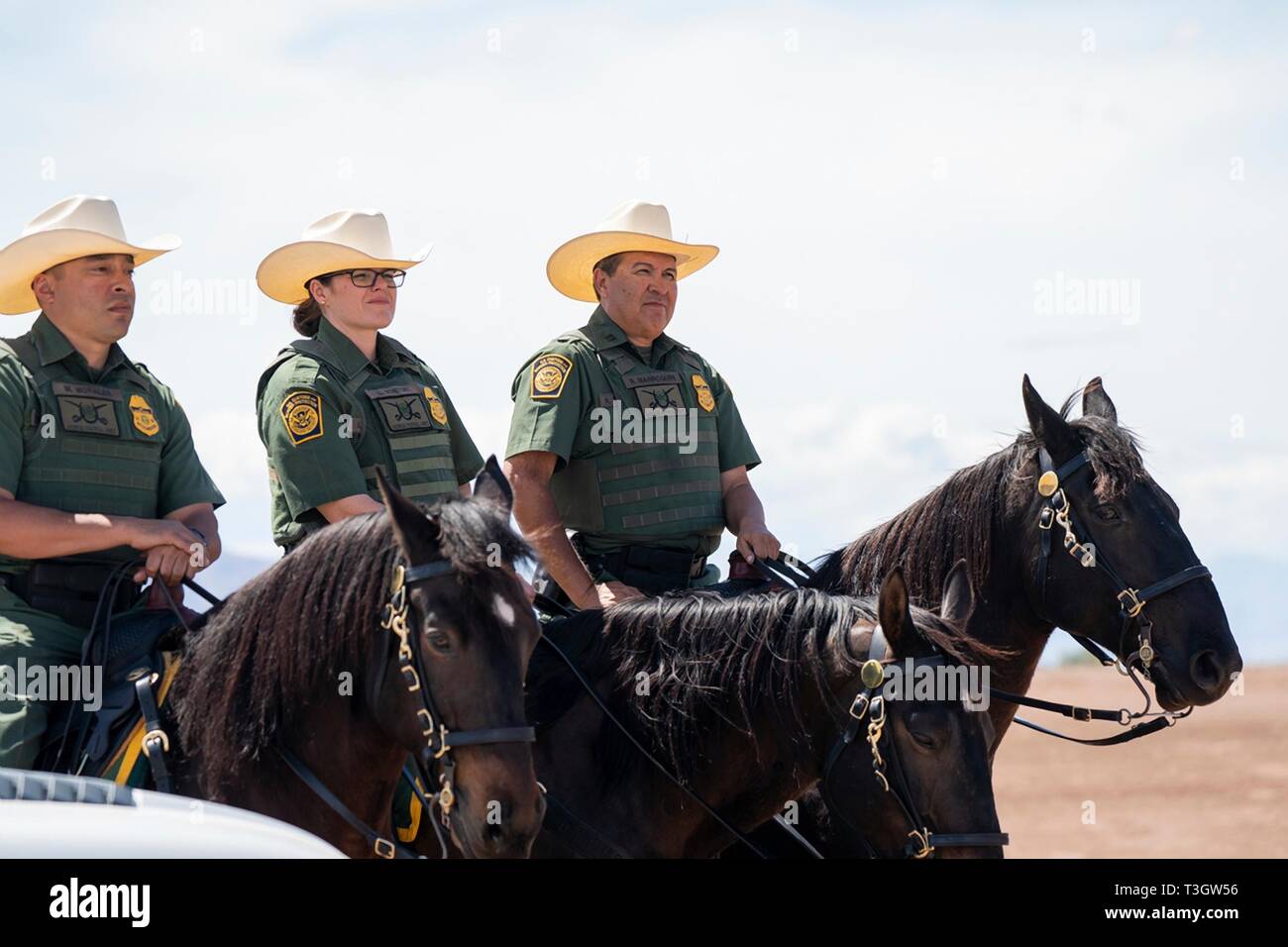 U.S Border Patrol agents on horseback listen as President Donald Trump ...