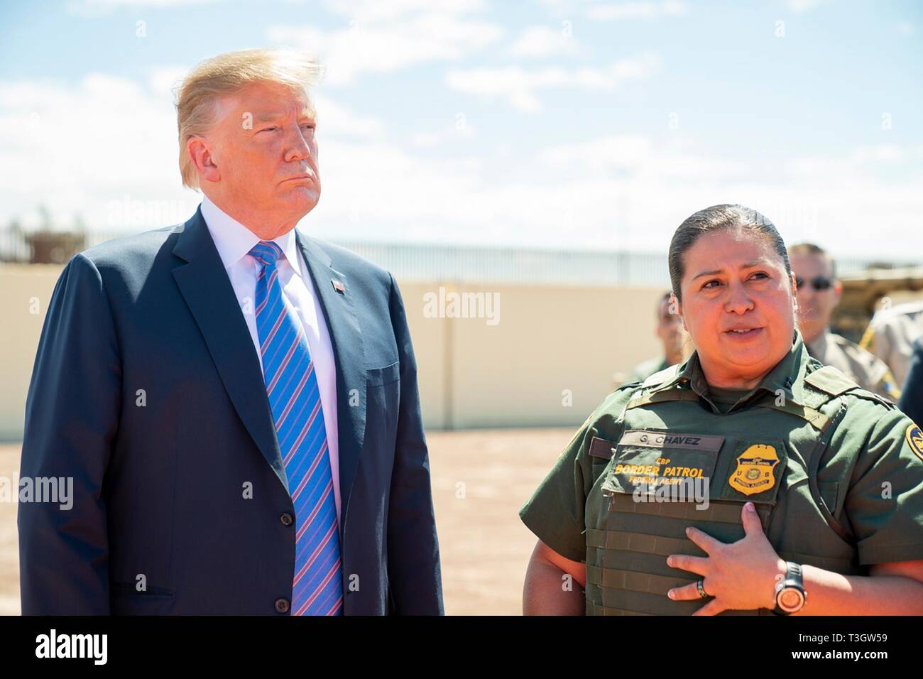 U.S President Donald Trump listens to CBP Agent Gloria Chavez, right ...