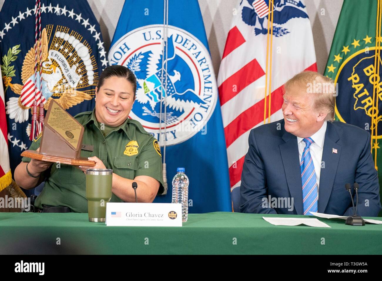 U.S President Donald Trump is presented with a gift from CBP Agent ...