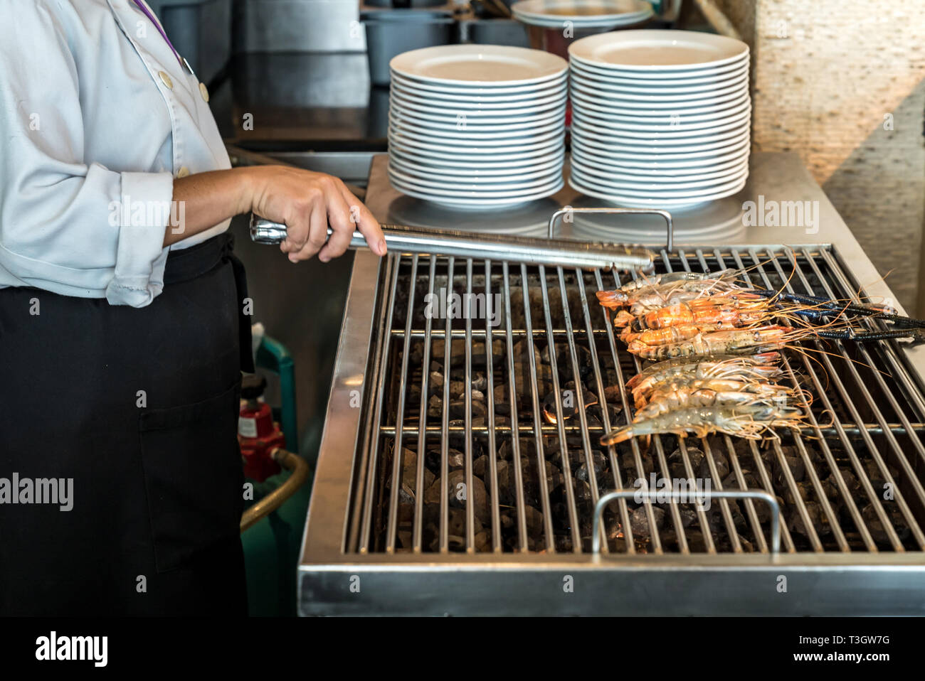 Chef cooking of Grilled Prawn Stock Photo - Alamy