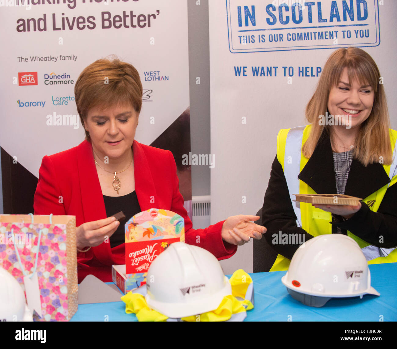 First Minister Nicola Sturgeon is presented with a box of chocolates ...