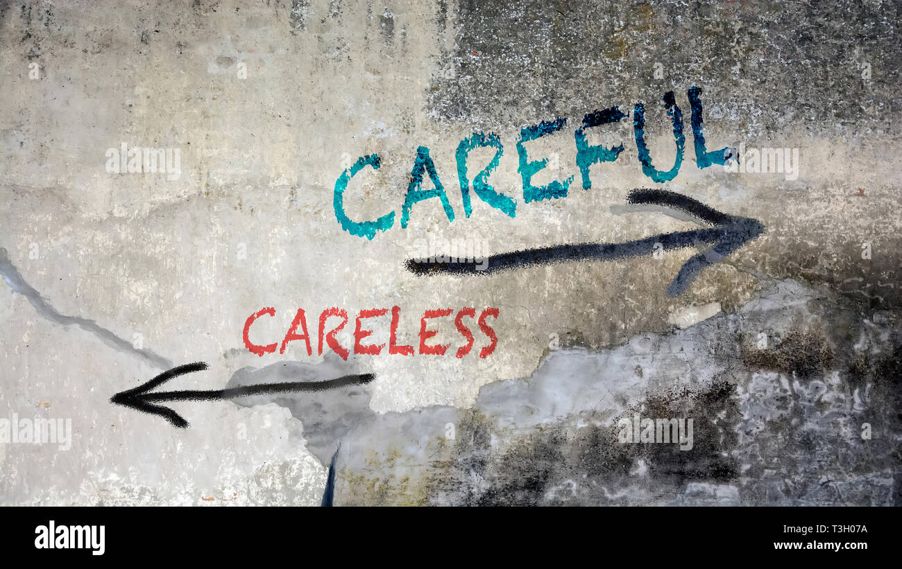 Wall Graffiti Careful versus Careless Stock Photo - Alamy