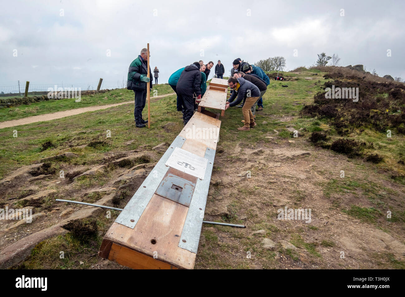Over 50 people install a 36-feet high cross ahead of Easter on Surprise ...