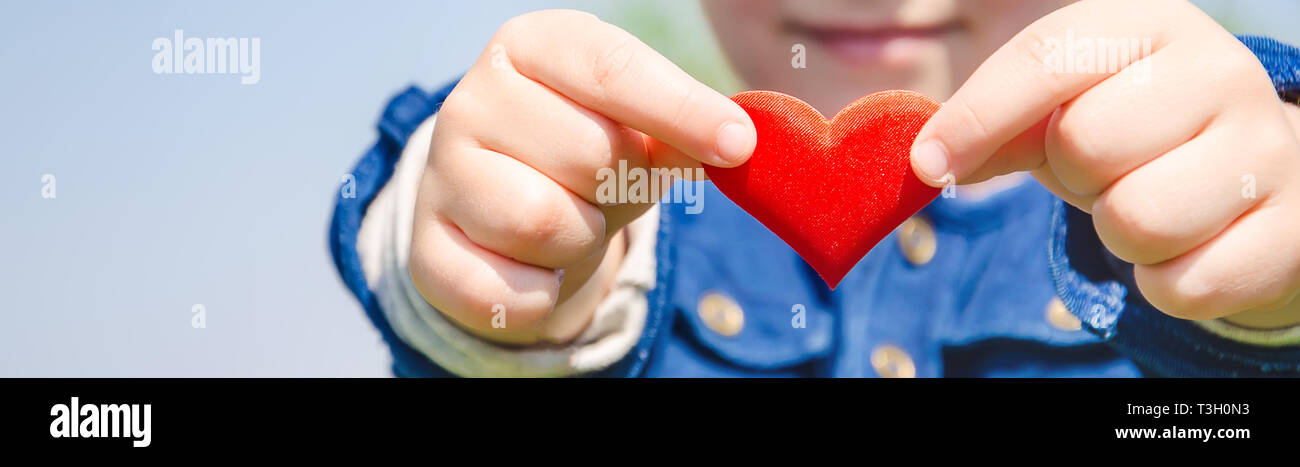The heart is in the hands of the child. Selective focus. nature Stock ...
