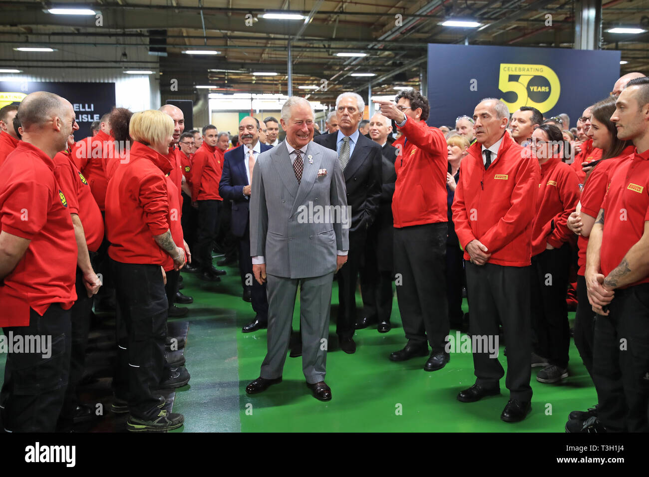 The Prince of Wales meets workers during his visit to Pirelli Tyres Ltd ...