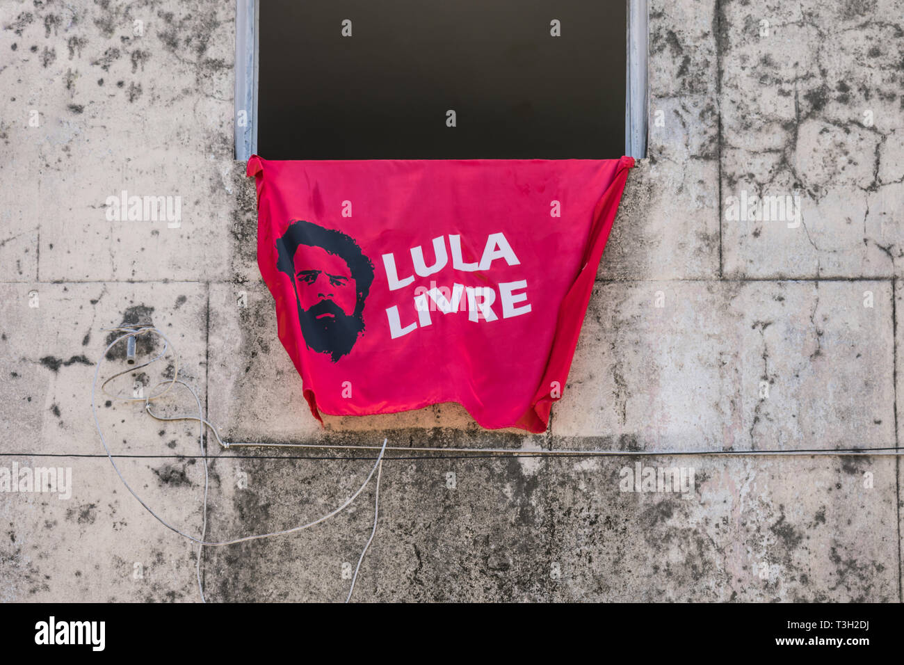 Red flag with "Lula Free" written in Portuguese hanging from outside a ...