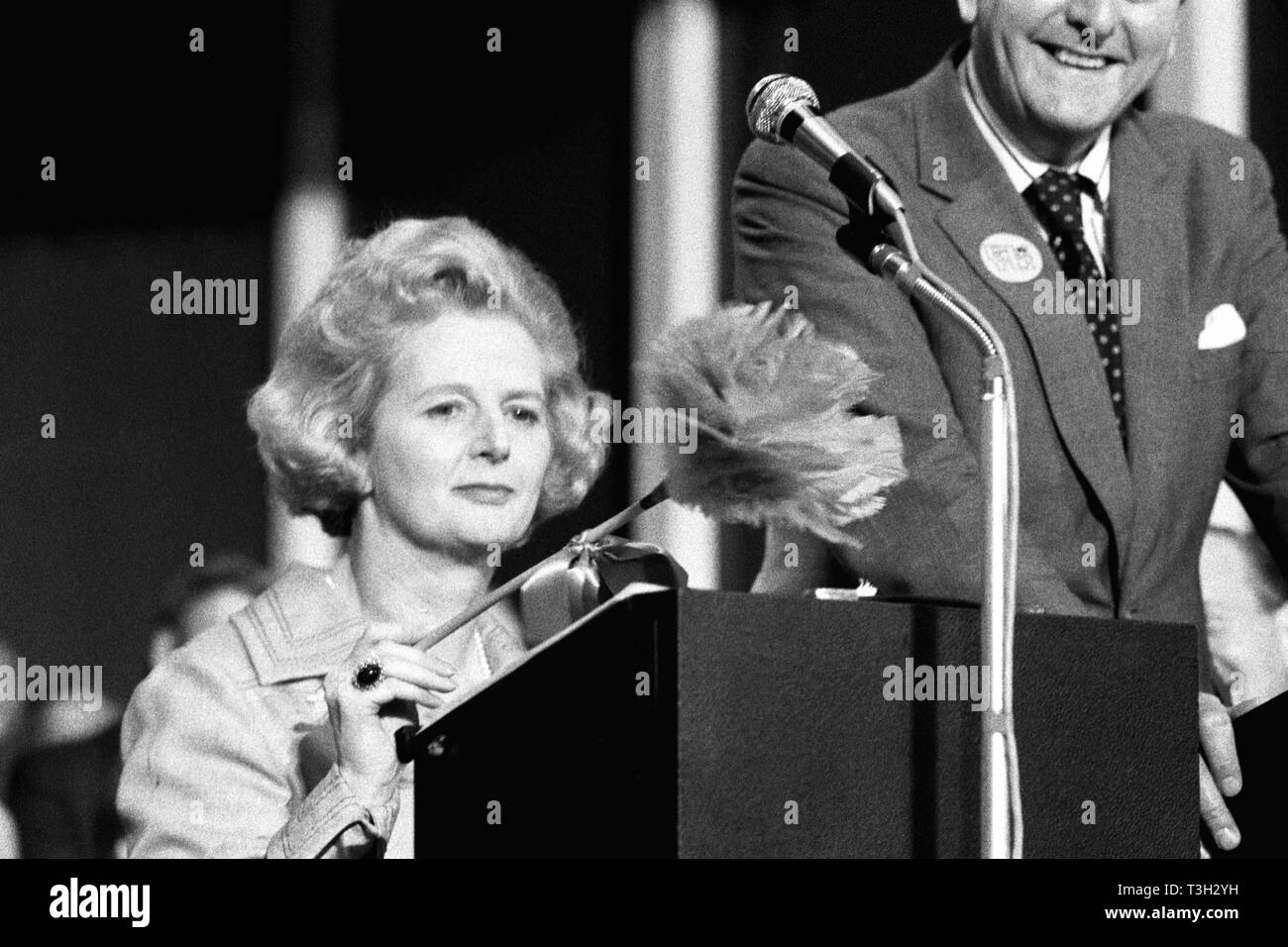 Margaret Thatcher "dusts up" with a feather duster presented to her ...