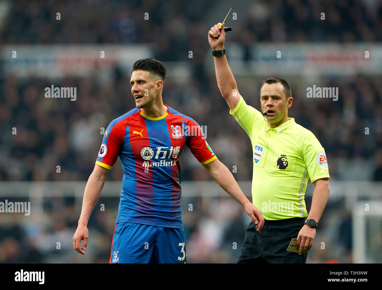 Crystal Palace's Martin Kelly is shown the yellow card by referee ...