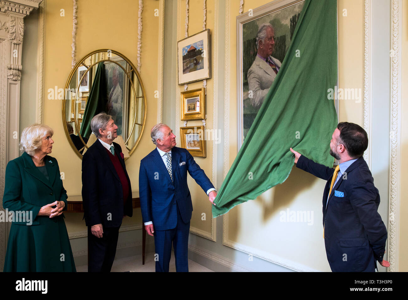 The Prince of Wales (third from left) unveils a new portrait of himself ...