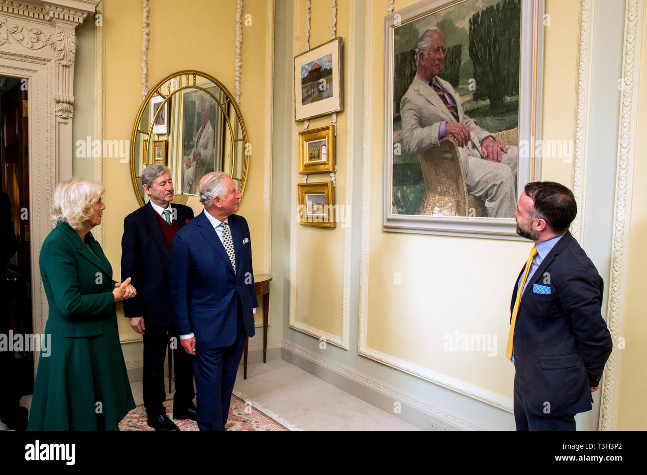 The Prince of Wales (third from left) unveils a new portrait of himself ...