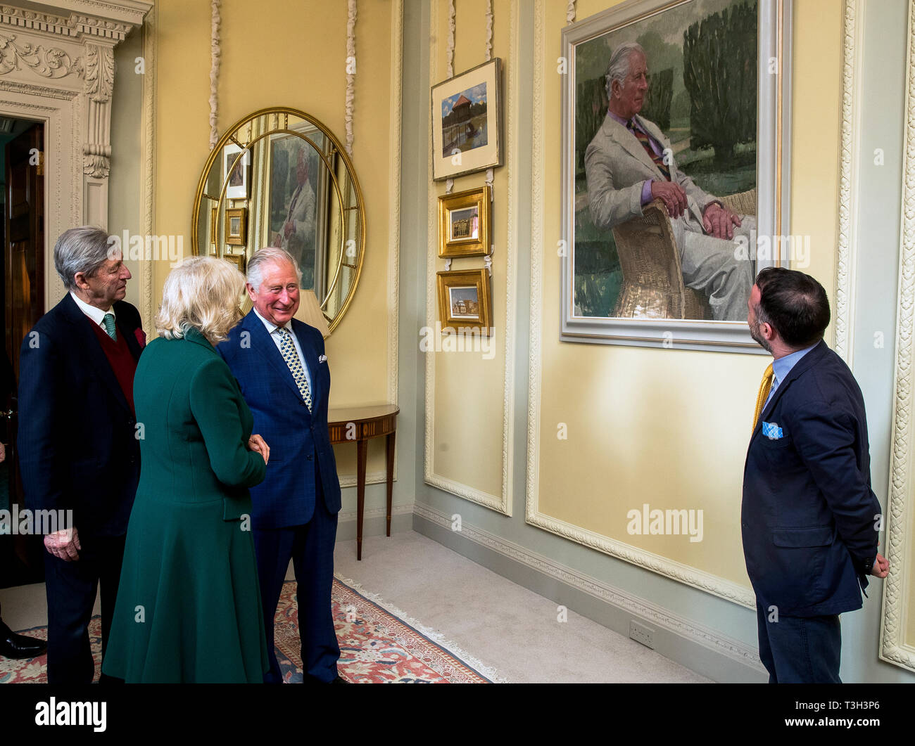 The Prince of Wales (third from left) unveils a new portrait of himself ...