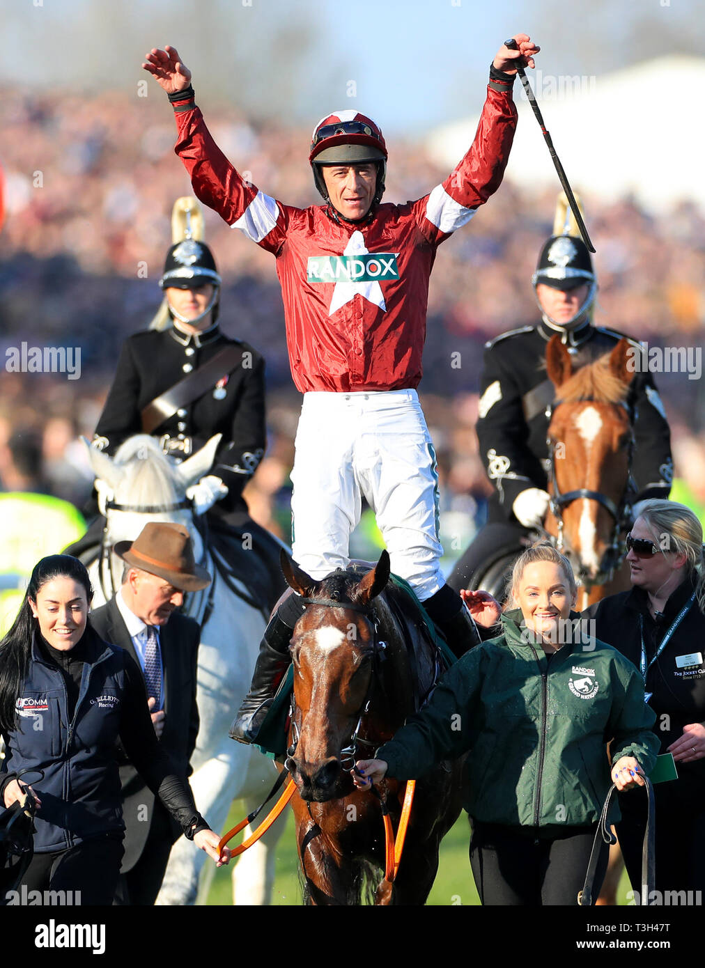 Jockey Davy Russell celebrates winning the Randox Health Grand National ...