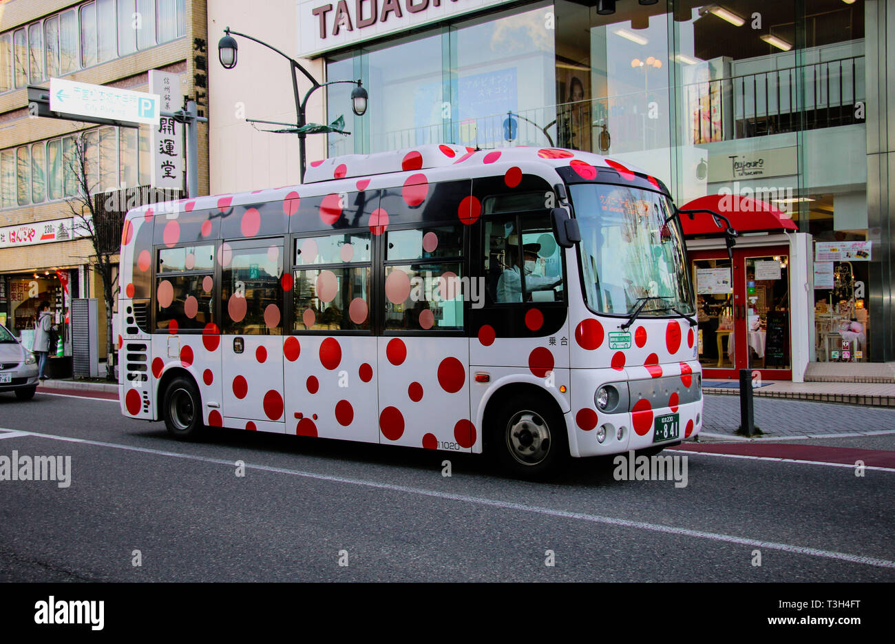 MATSUMOTO, JAPAN- MARCH 26, 2019: City bus with bright red circles on a ...
