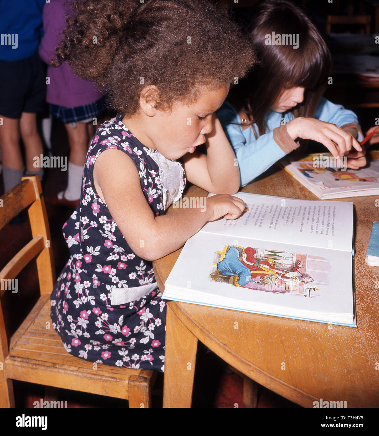 Two children reading classroom together hi-res stock photography and ...