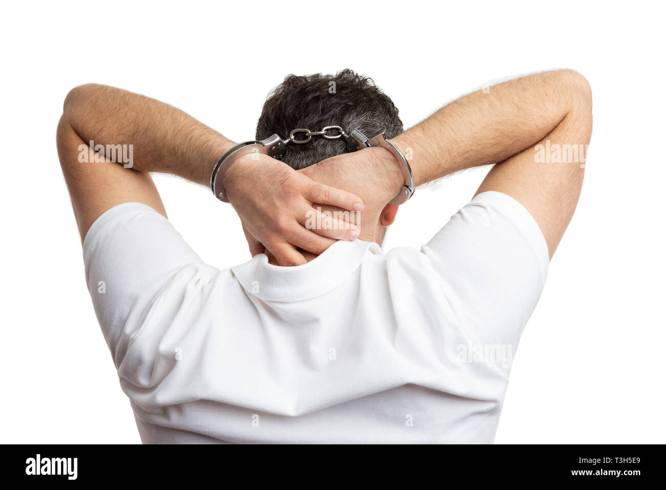 Man hands handcuffed behind back hi-res stock photography and images ...