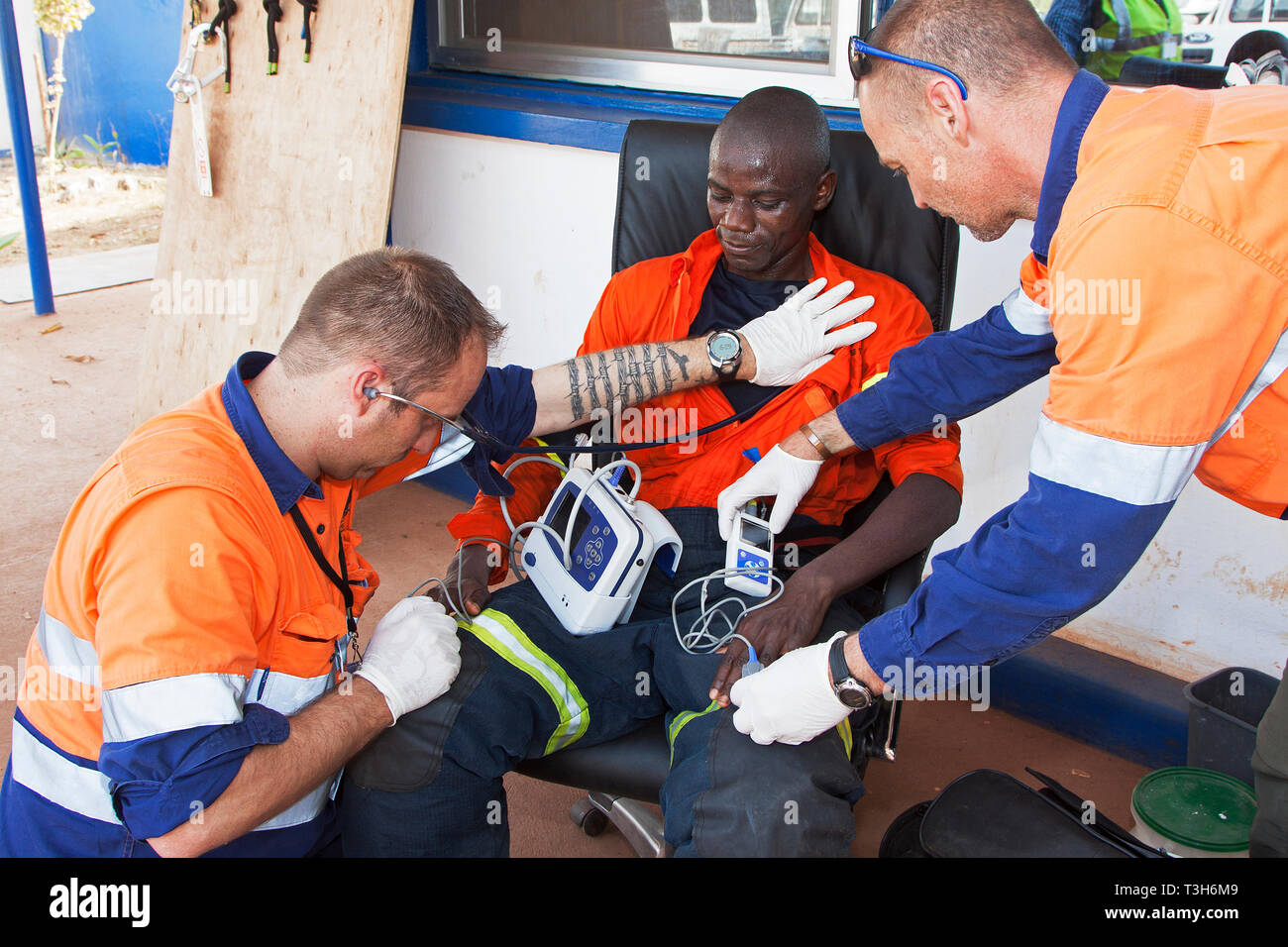 Paramedics from emergency response team check fire fighter after ...