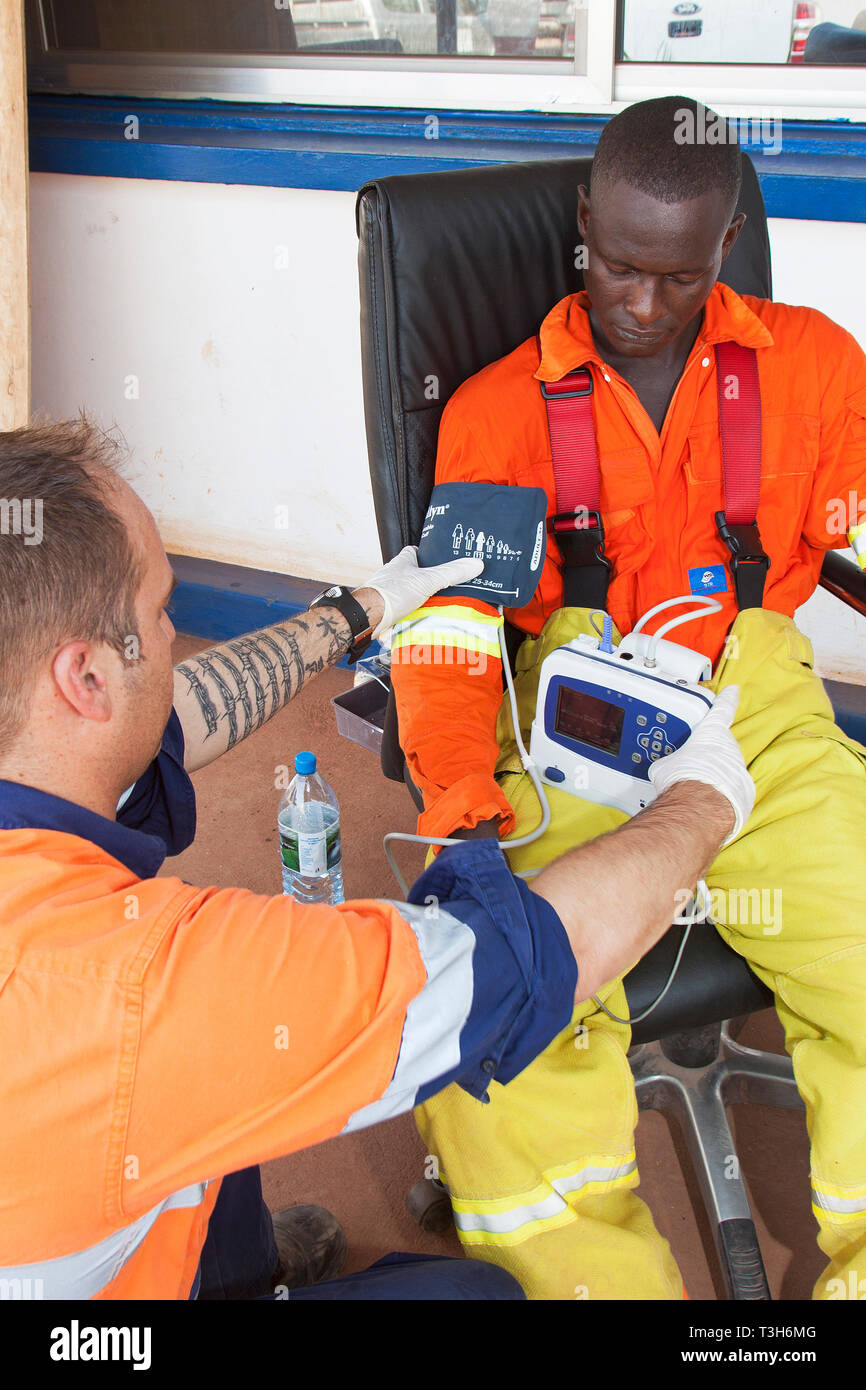 Paramedic from emergency response team check fire fighter after ...