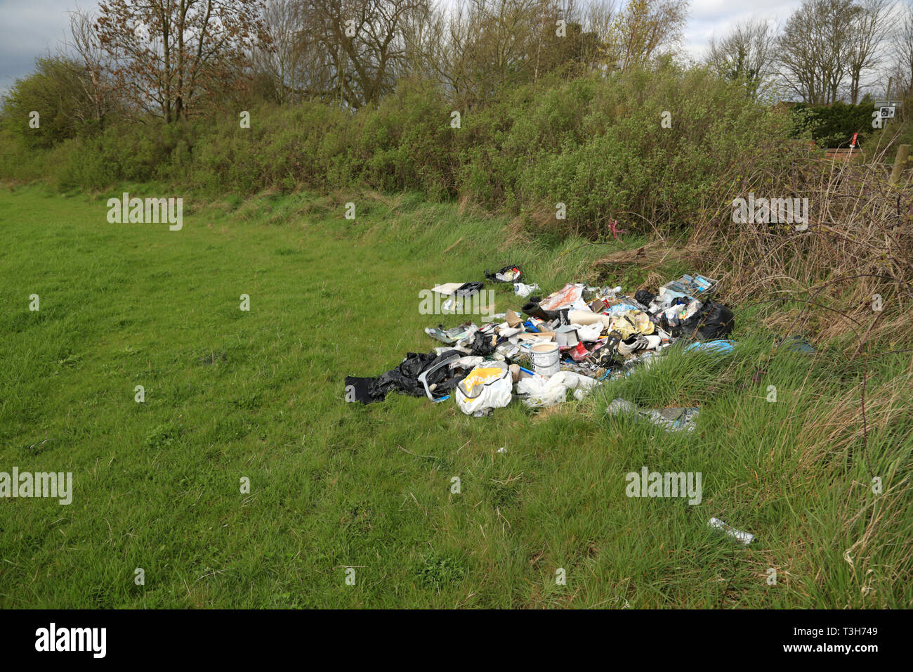 Household waste dumped in the English countryside, UK Stock Photo - Alamy