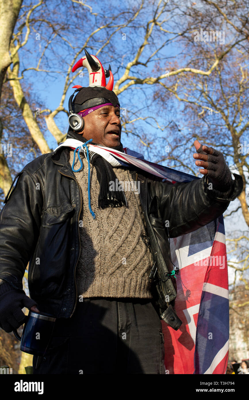 A street preacher talkling with passion at dusk in December in the ...