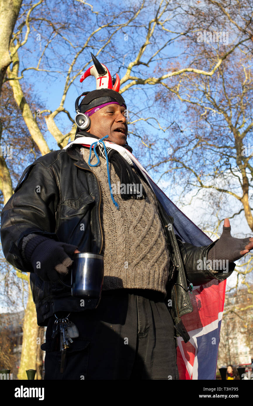 A street preacher talkling with passion at dusk in December in the ...