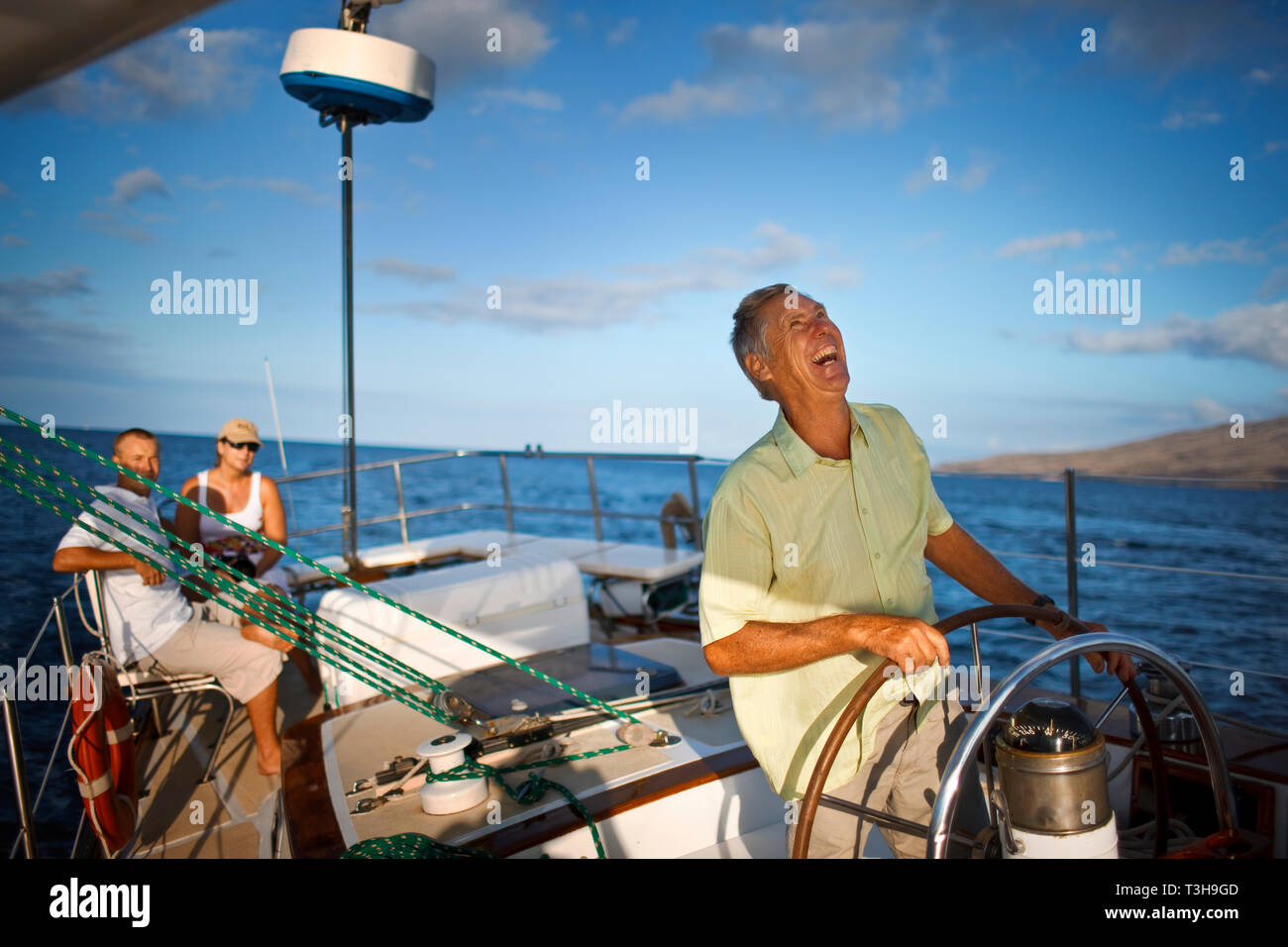 Friends laughing on a sailing boat Stock Photo - Alamy