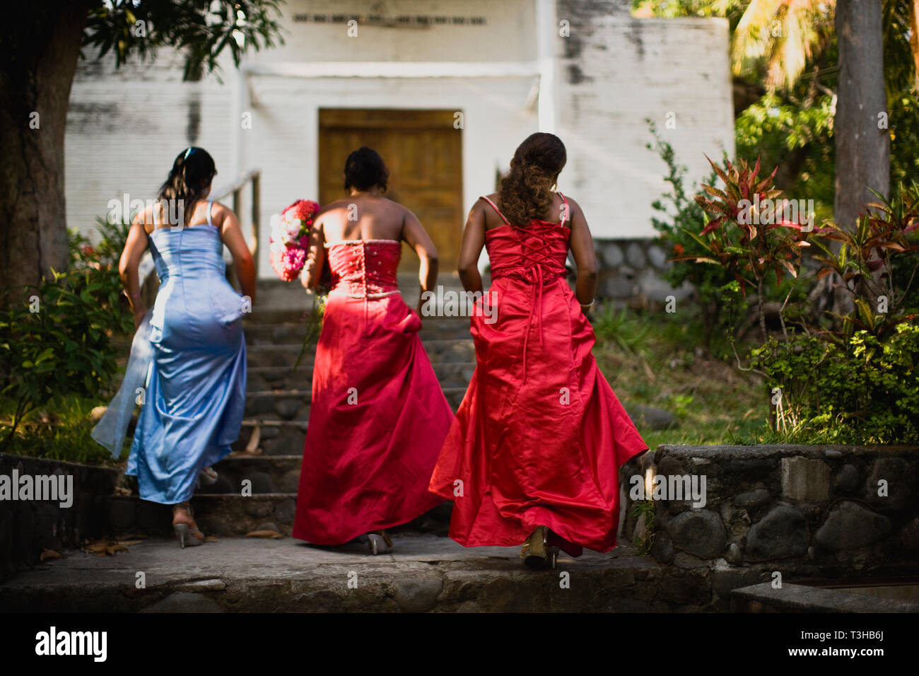 Girls walking up stone steps in prom dresses, El Salvador Stock Photo ...