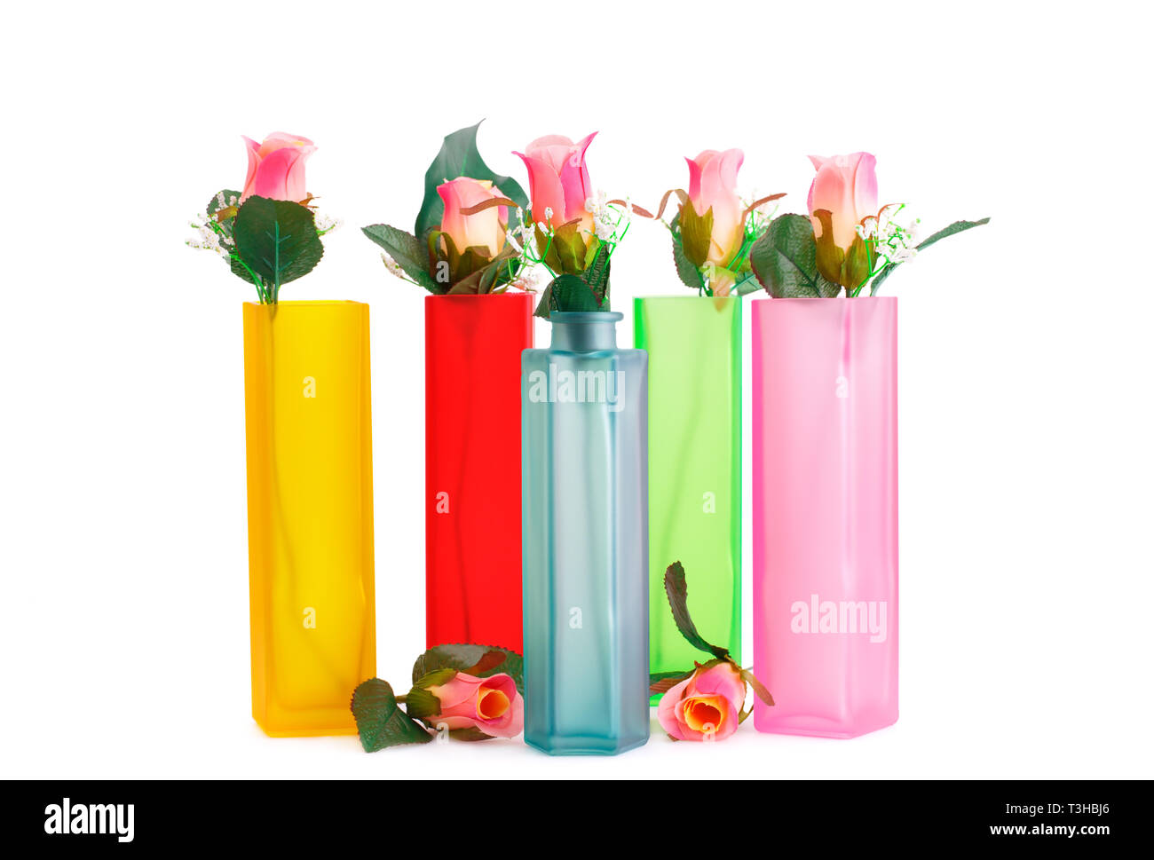 Colorful fabric roses in glass vases isolated on white background Stock ...