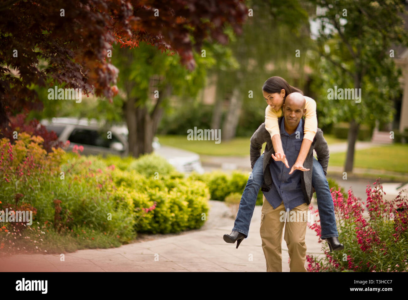 Piggy back ride adults hi-res stock photography and images - Alamy
