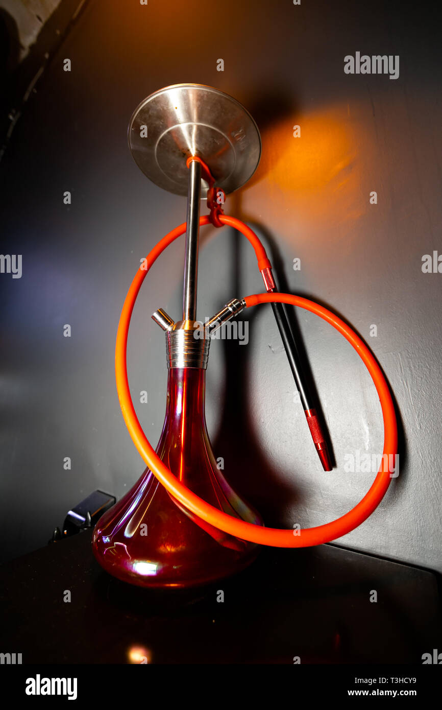 Waterpipe in a nightclub - Red beautiful color shisha Stock Photo - Alamy