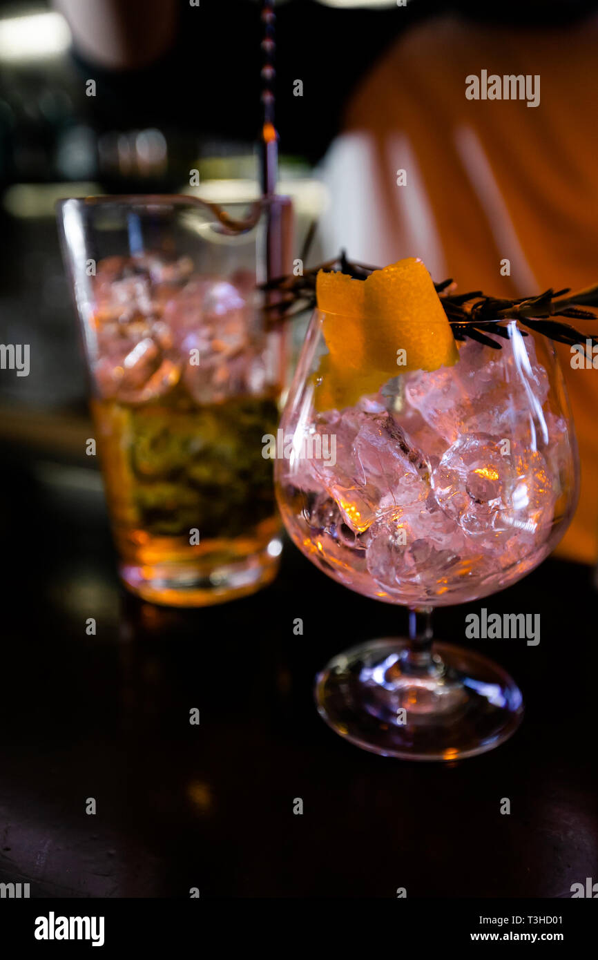 Cocktails by a barmen in a nightclub - Bartender skills are shown Stock ...