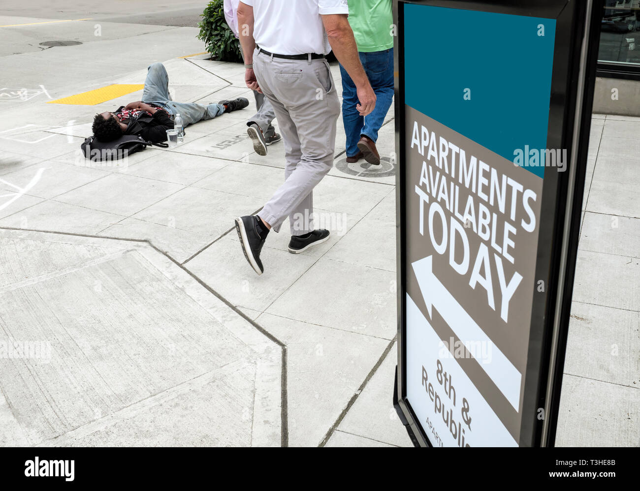 Homeless man sleeping on sidewalk hi-res stock photography and images ...