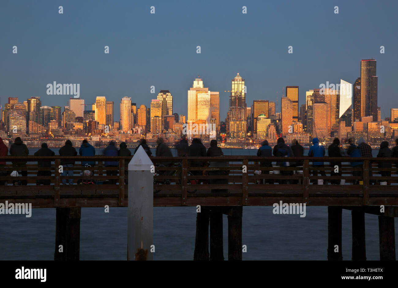WA16112-00...WASHINGTON - Setting sun creating a glow on downtown ...